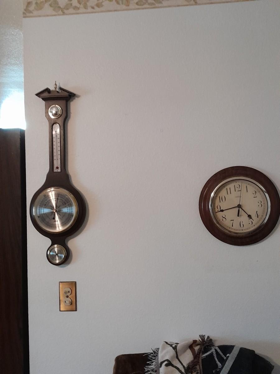 Wood framed wall clock and a Banjo style Jason wall hanging weather ...