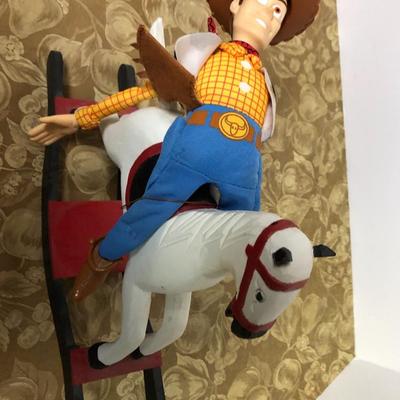 Three Toy Story WOODYs & A Wooden Rocking Horse | EstateSales.org