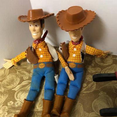 Three Toy Story WOODYs & A Wooden Rocking Horse | EstateSales.org