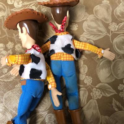 Three Toy Story WOODYs & A Wooden Rocking Horse | EstateSales.org
