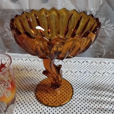 AMBER GLASS COMPOTE, MILK GLASS SWAN, GLASS PITCHER AND 4 GLASSES ...