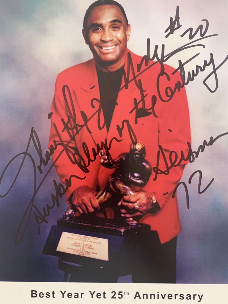 Football player Johnny Rodgers signed photo. | EstateSales.org