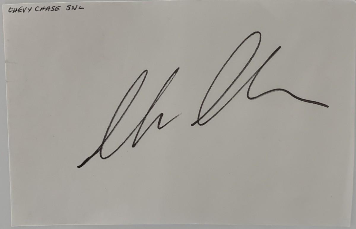 Caddyshack Chevy Chase signature cut. GFA Authenticated | EstateSales.org