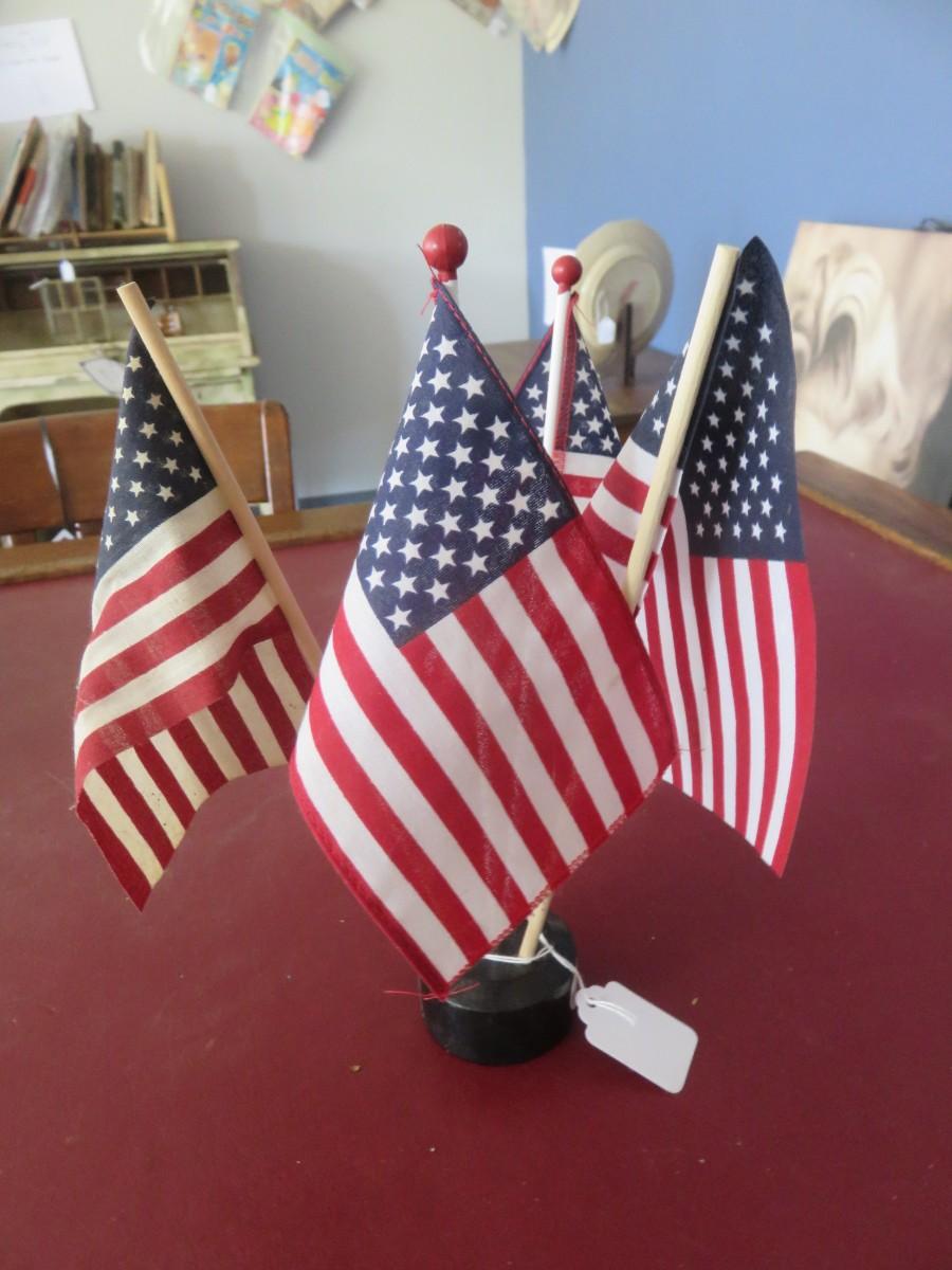 4 Small American Flags In Desk Display Stand EstateSales 4-small-american-flags-in-desk-display-stand-estatesales