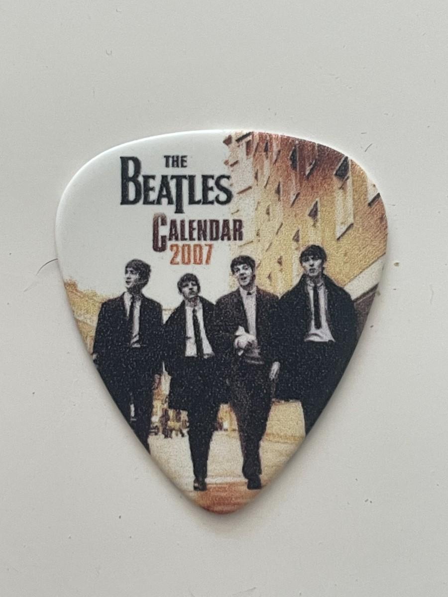 The Beatles guitar pick | EstateSales.org