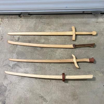 (4) Long Wood Swords | EstateSales.org