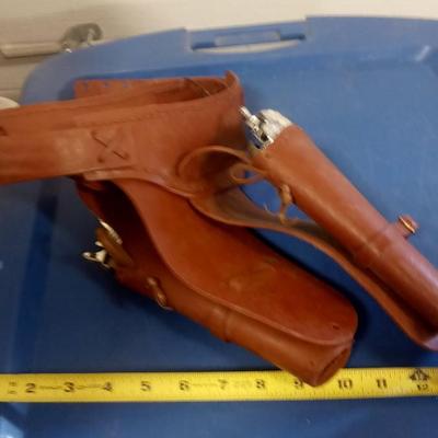LOT 73 TWO KIT CARSON TOY CAP GUNS WITH HOLSTERS | EstateSales.org