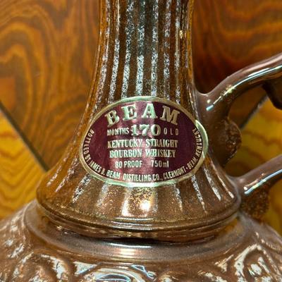 1980 JIM BEAM GOLD TITAN SEALED LIQUOR DECANTER | EstateSales.org