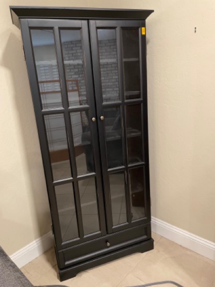 Black curio cabinet | EstateSales.org