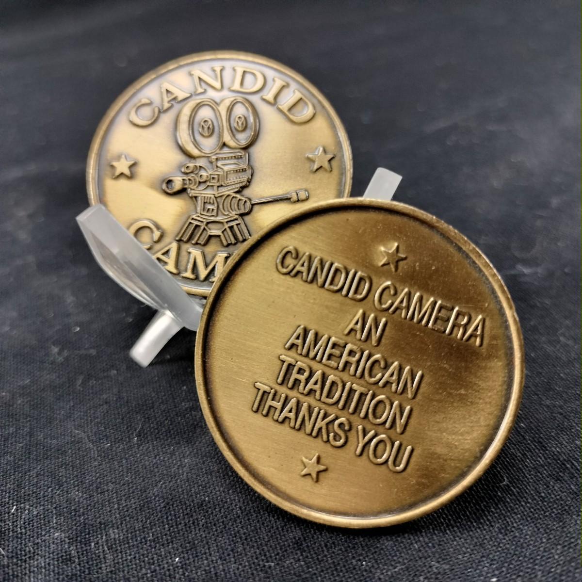 Pair of Candid Camera Tokens | EstateSales.org