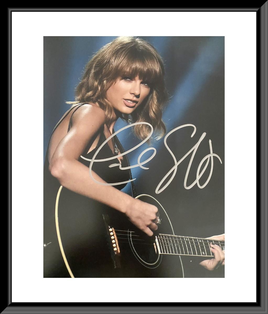 Taylor Swift signed photo | EstateSales.org