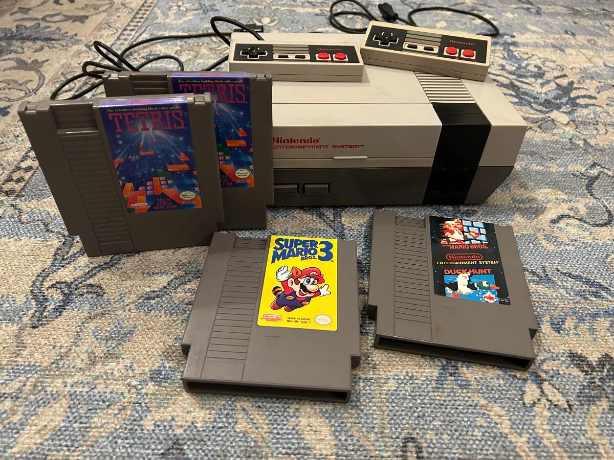 LOT 100C: Vintage Nintendo Console, Controllers And Games | EstateSales.org