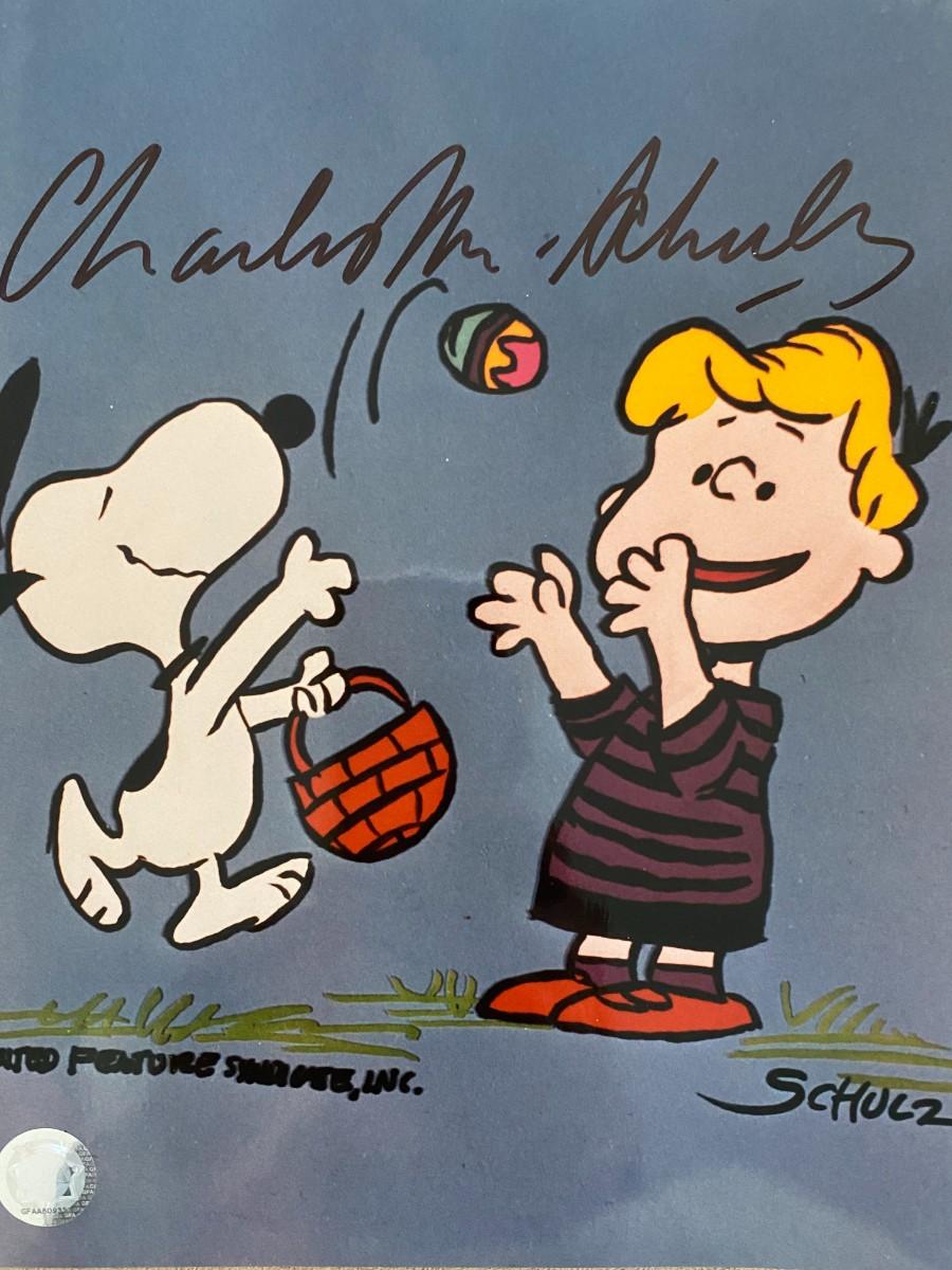 Peanuts Charles Schulz signed photo. GFA Authenticated | EstateSales.org