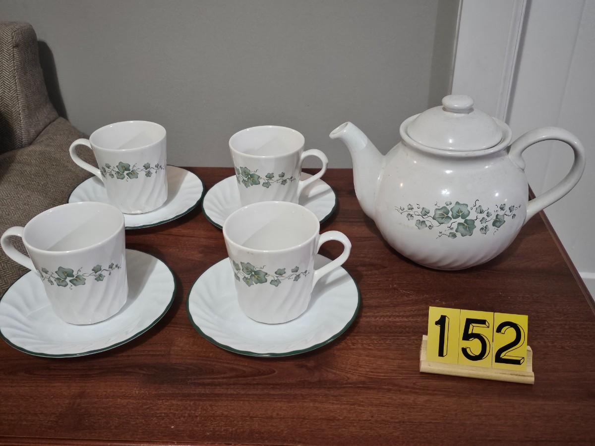 Corelle teapot, 4 cups, 4 saucers | EstateSales.org