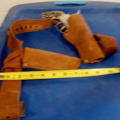 LOT 194 SHOOTING SHELL CAP GUN AND LEATHER BELT HOLSTER | EstateSales.org