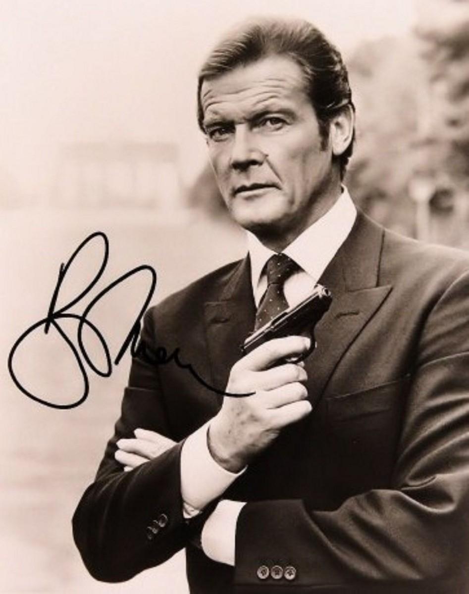 Roger Moore signed movie still photo | EstateSales.org