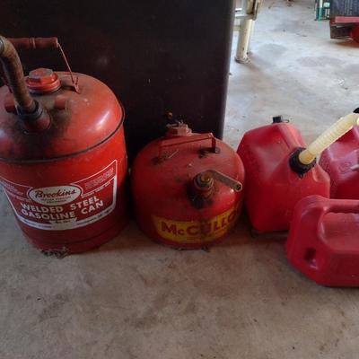 Set of Five Gas Cans Metal and Plastic Various Sizes | EstateSales.org
