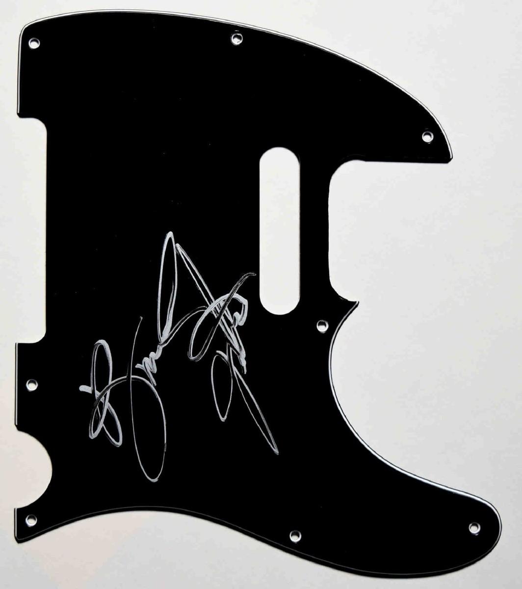 Bruce Springsteen signed pickguard | EstateSales.org