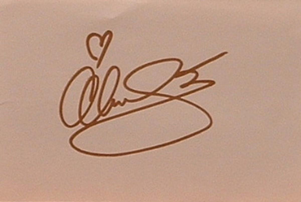 Alicia Silverstone signature slip | EstateSales.org
